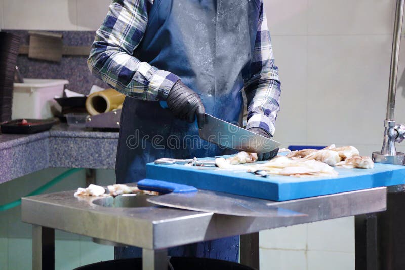 Fishmonger cutting fish stock photo. Image of meal, human - 376141196