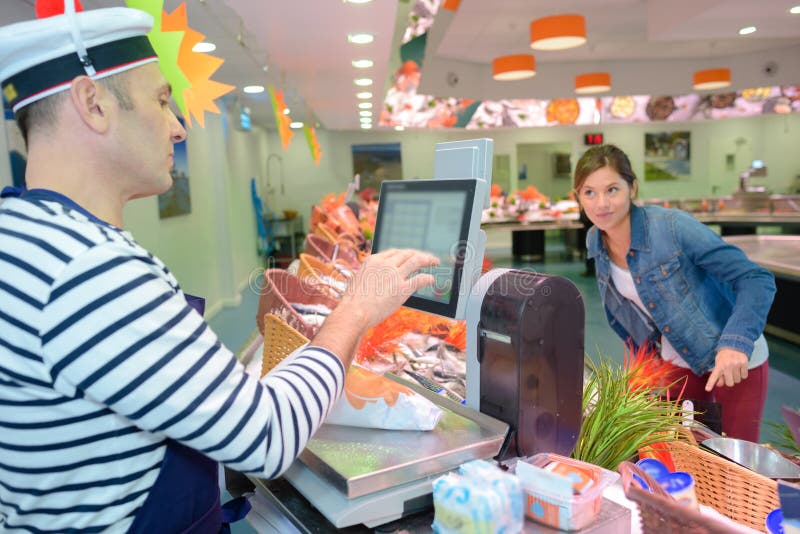Fishmonger Weighing Fish for Customer Stock Photo - Image of shellfish ...