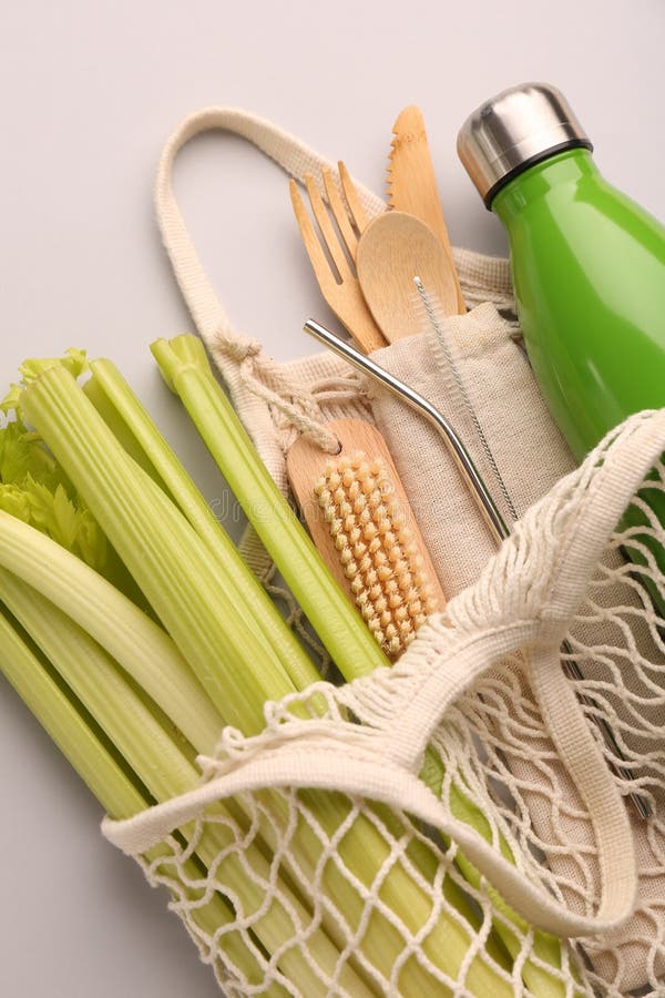 Fishnet Bag with Different Items on Light Grey Background, Top View ...