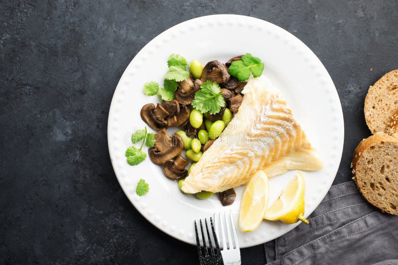 Fishplate. Sea White Cod Fish with a Side Dish of Vegetables and ...