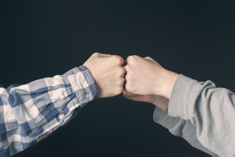 Fist Bump or Knuckle Bump between Two Friends F Stock Image - Image of ...