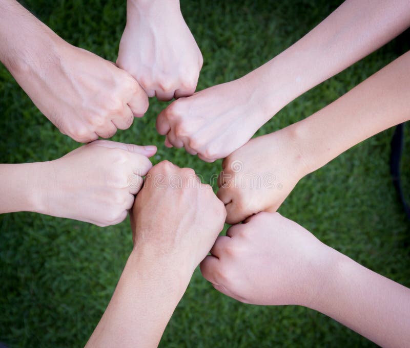 Fist Bumping Corporate Colleagues Teamwork - Synchronization of the ...