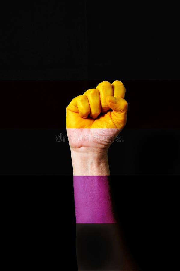 Fist Hand with Non-binary Pride Flag Patterned Isolate on Black. LGBTQ+ ...