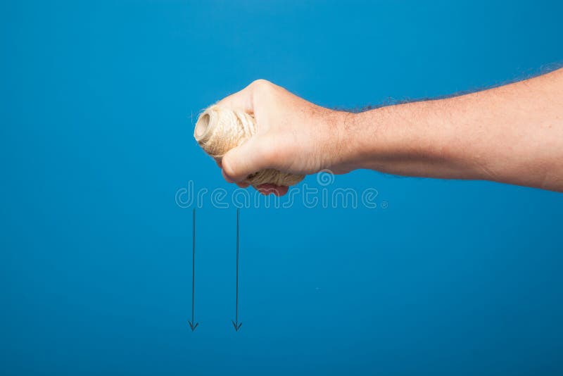 Fist of the Right Hand with Rope Stock Photo - Image of roll, bottom ...