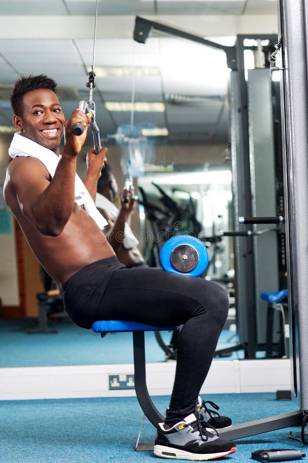 Fit African Trainer Working Out in Multi Gym Stock Photo - Image of ...