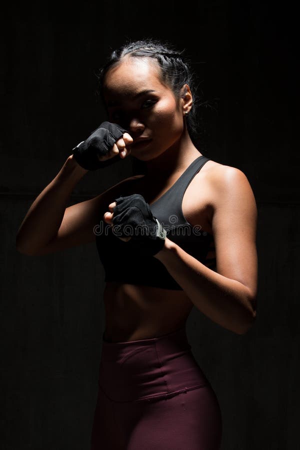 Fit woman in fighting pose stock photo. Image of endurance - 156879680