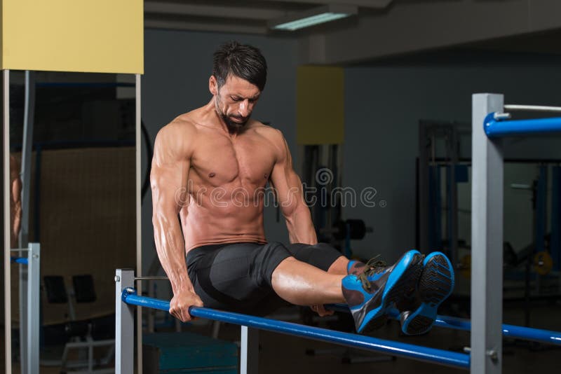 Fit Athlete Doing Exercise on Parallel Bars Stock Photo - Image of ...