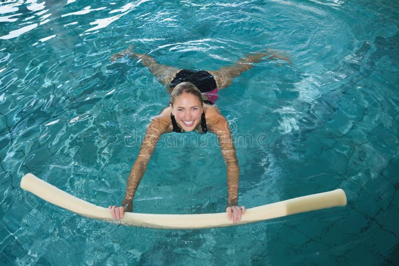 Fit Blonde Swimming with Foam Roller Stock Photo - Image of water ...