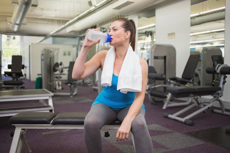 Fit Brunette Drinking from Sports Bottle Stock Image - Image of ...