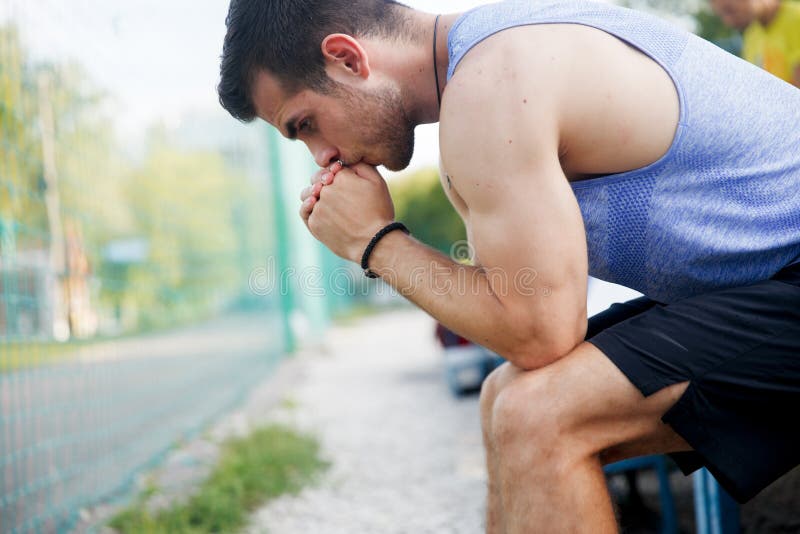 Fit Caucasian Man Pensively Sitting Leaning on His Hands Stock Photo ...