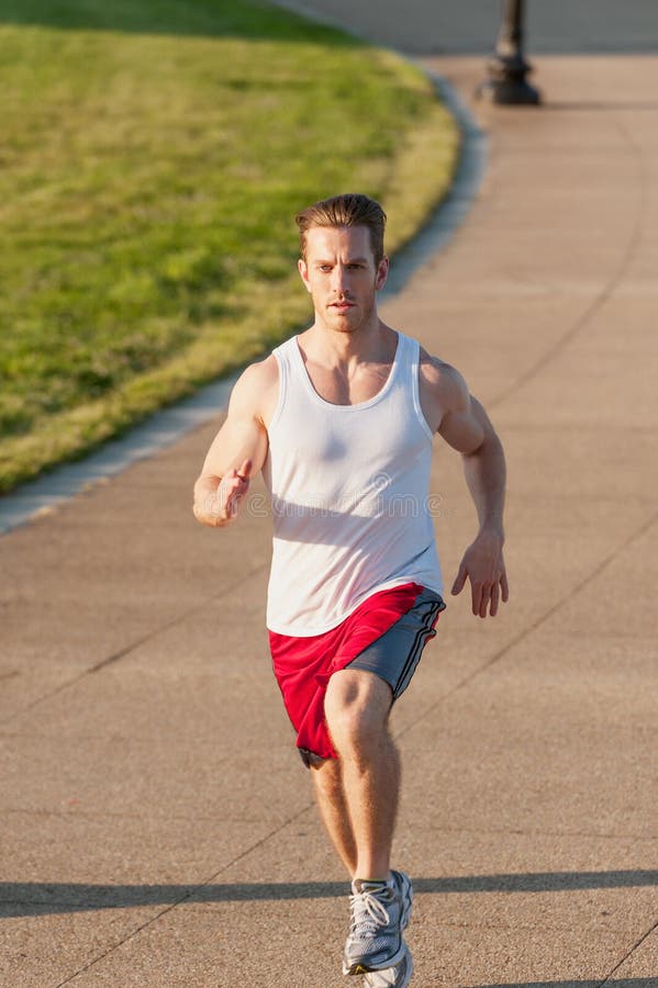 Fit Caucasian Man Spinting during an Early Morning Workout Stock Photo ...