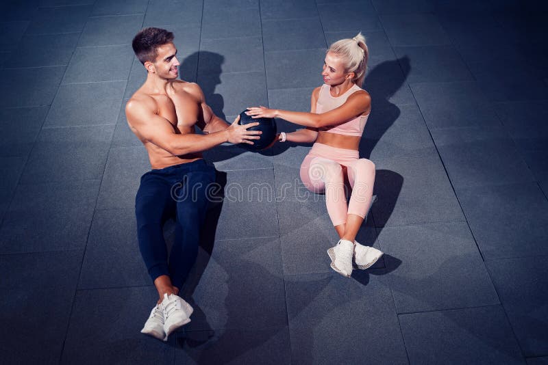 Fit Couple Doing Abdominal Ball Exercise at Gym Stock Photo - Image of ...