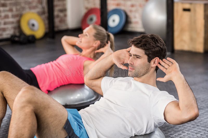 Fit Couple Doing Abdominal Crunches Stock Image - Image of crunches ...