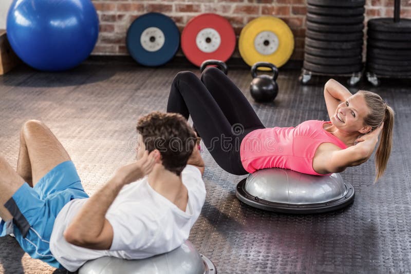 Fit Couple Doing Abdominal Crunches Stock Photo - Image of blonde, care ...