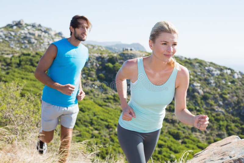 Fit Couple Jogging through Countryside Stock Photo - Image of adult ...