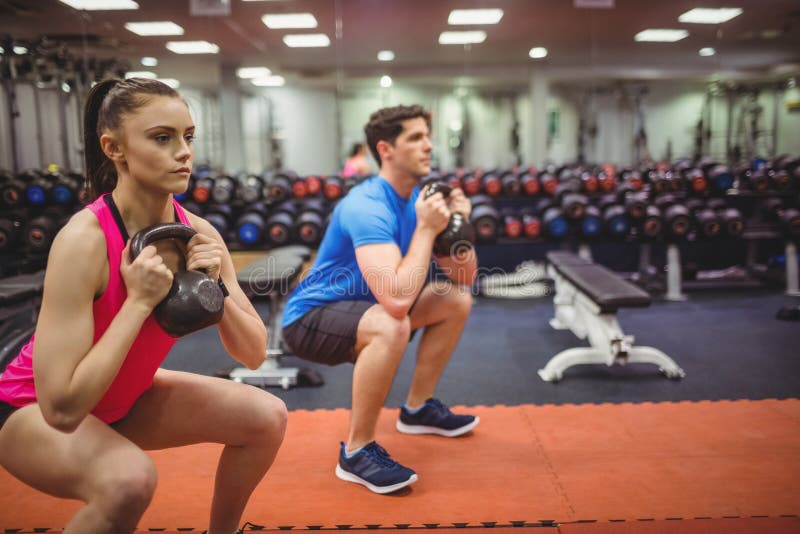 Fit Couple Working Out in Weights Room Stock Image - Image of health ...