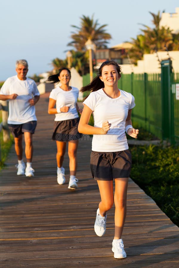 Family jogging beach stock photo. Image of energetic - 30944056