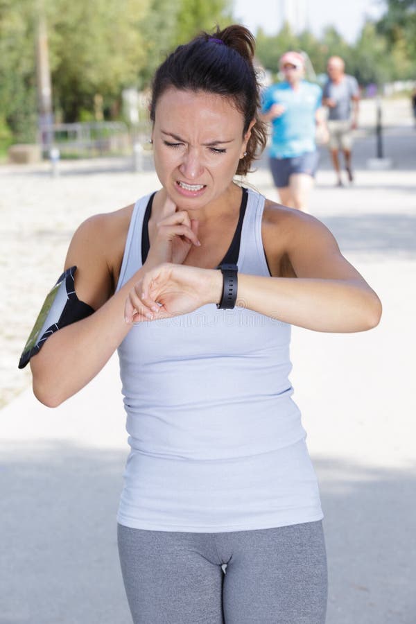 Fit Female Runner Looking at Watch Stock Image - Image of exercise ...