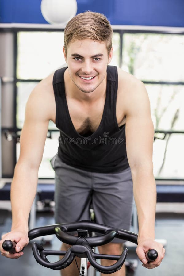 Fit Group of People Using Exercise Bike Together Stock Photo - Image of ...