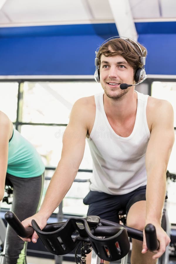 Fit Group of People Using Exercise Bike Together Stock Photo - Image of ...