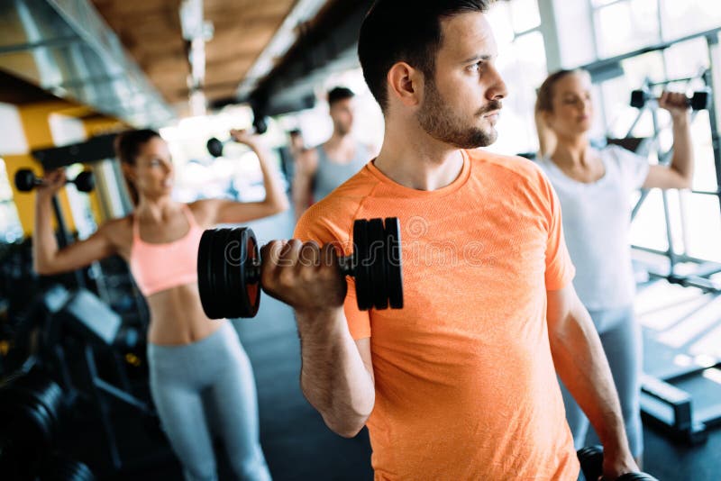 Fit Man Exercising at the Gym on a Machine Stock Image - Image of body ...