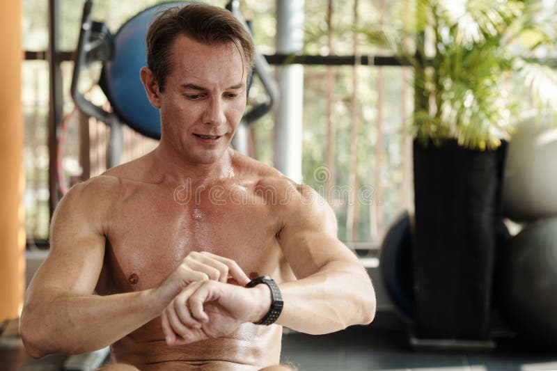 Fit Man Checking Fitness Tracker Stock Image - Image of exercising ...