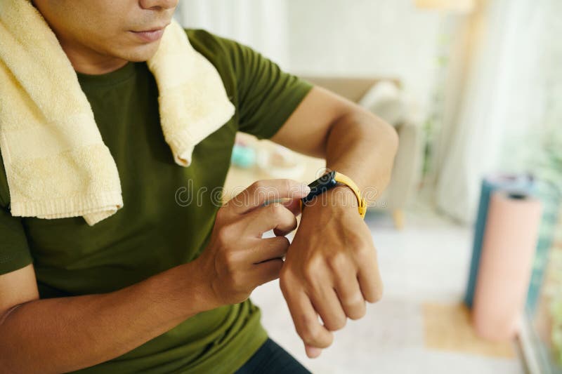 Fit Man Checking Pulse on Tracker Stock Photo - Image of jogger, active ...