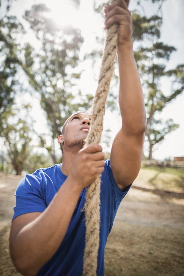 Fit Man Climbing Rope during Obstacle Course Stock Image - Image of ...