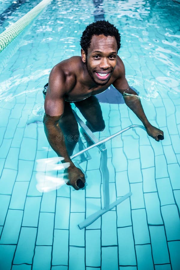 Fit Man Cycling in the Pool Stock Photo - Image of health, pursuit ...