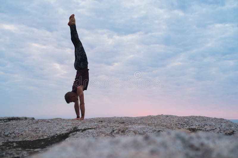 Fit Man Doing a Hand Stand during Yoga Practice Outside Stock Image ...