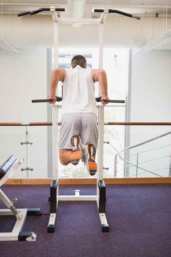 Fit Man Doing Pull Ups in Fitness Studio Stock Image - Image of ...