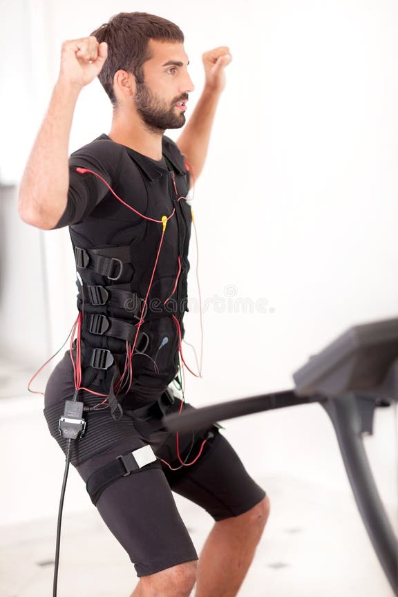 Fit Man Exercise on Electro Muscular Stimulation Machine Stock Photo ...
