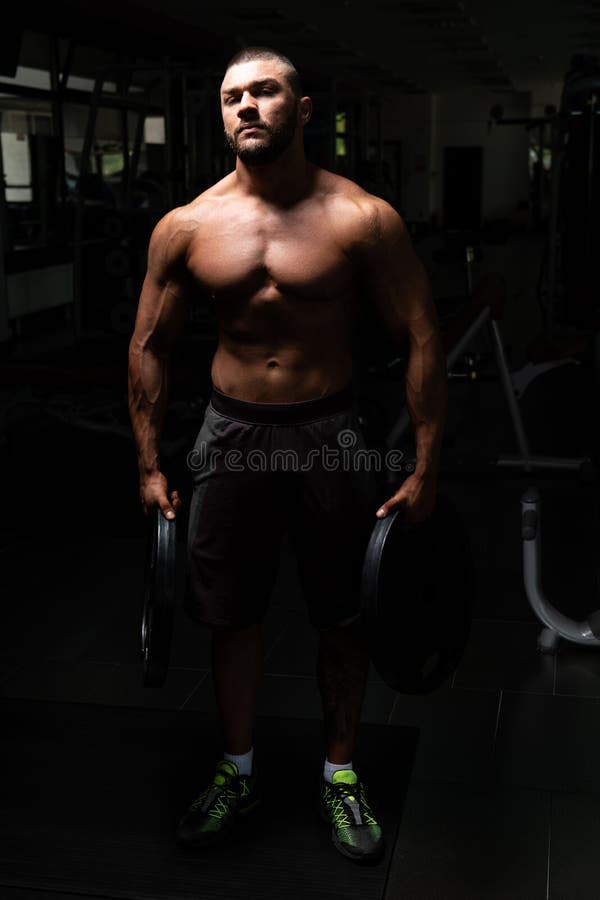 Fit Man Holding Weights in Hand Stock Photo - Image of chest, muscle ...