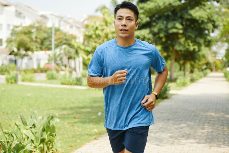 Fit Man Jogging in Park stock image. Image of jogger - 309814095