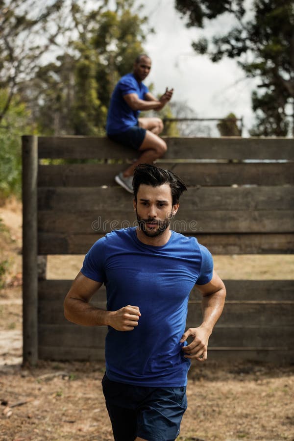 Fit Man Running during Obstacle Course Stock Photo - Image of fitness ...