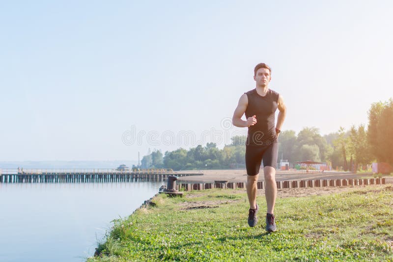 Fit Man Running Outdoor in Nature on Beach Morning Training. Stock ...