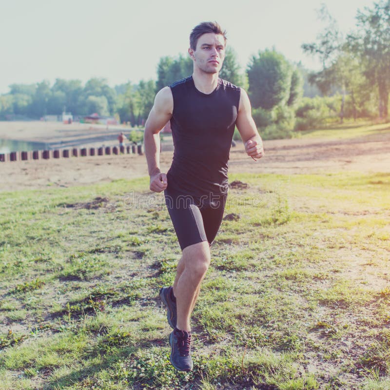 Fit Man Running Outdoor in Nature on Beach Morning Training. Stock ...