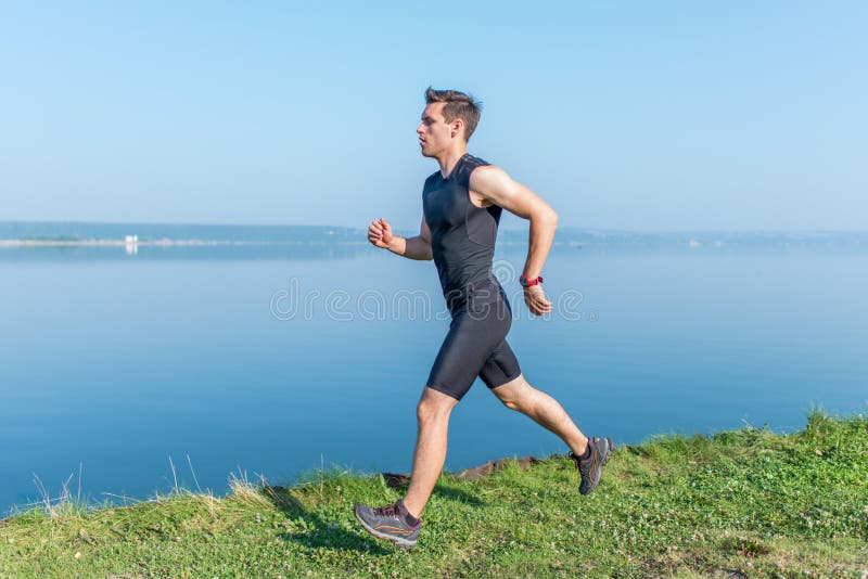 Fit Man Running Outdoor in Nature on Beach Morning Training. Stock ...