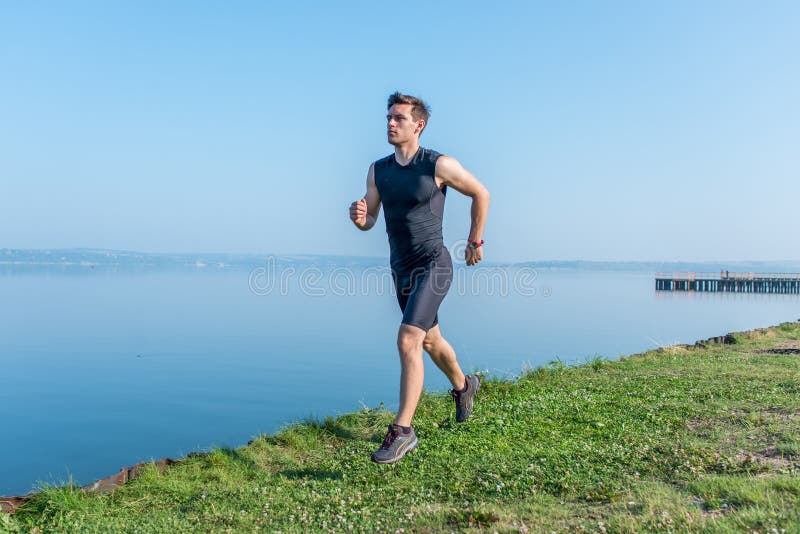 Fit Man Running Outdoor in Nature on Beach Morning Training. Stock ...