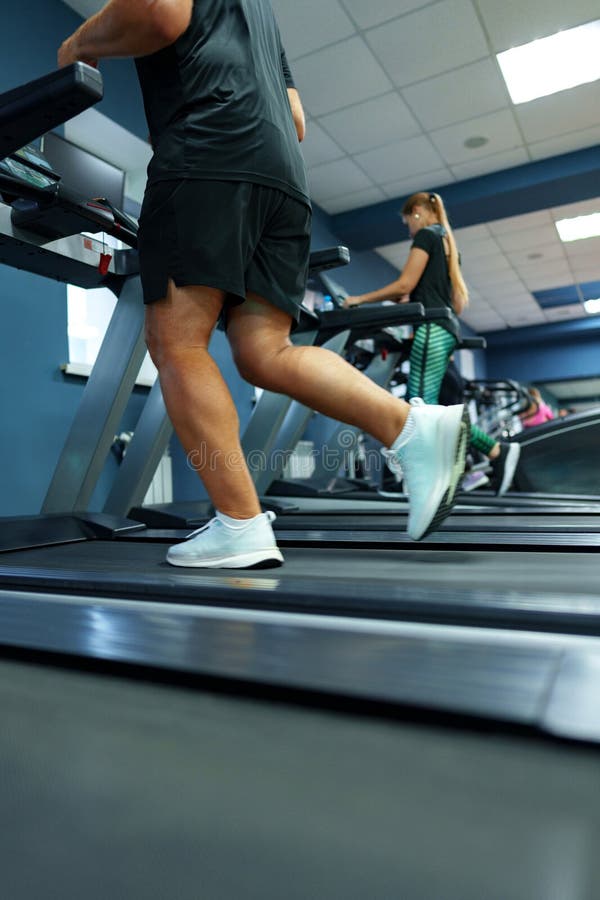 Fit Man Running on Treadmill in a Gym Stock Photo - Image of strength ...