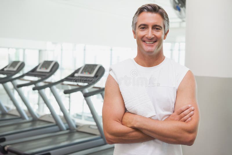 Fit Man Smiling at Camera beside Treadmills Stock Image - Image of ...