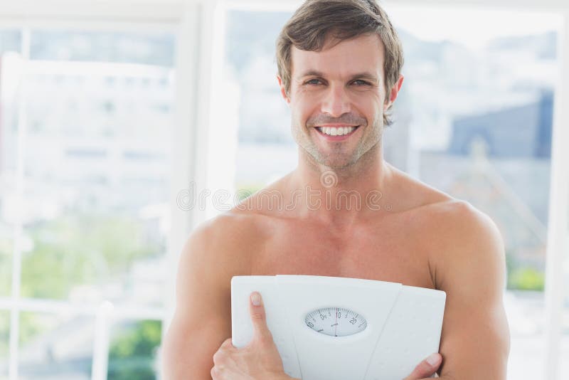 Fit Man Standing with Scale in Exercise Room Stock Image - Image of ...