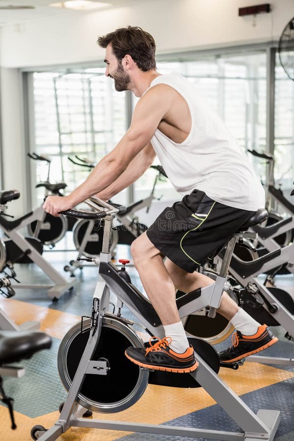 Fit Man Using Exercise Bike Stock Photo - Image of fitness, adult: 66432120