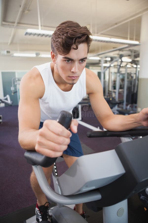Fit Man Working Out on the Exercise Bike Stock Image - Image of studio ...