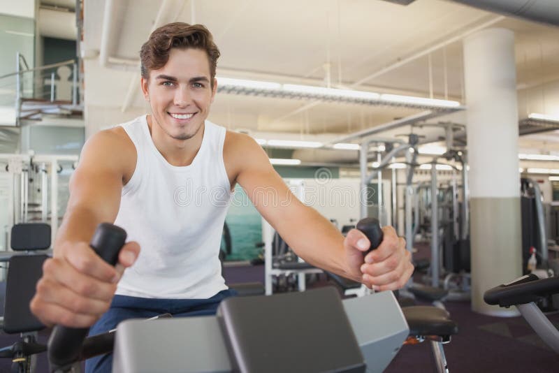 Fit Man Working Out on the Exercise Bike Stock Photo - Image of ...