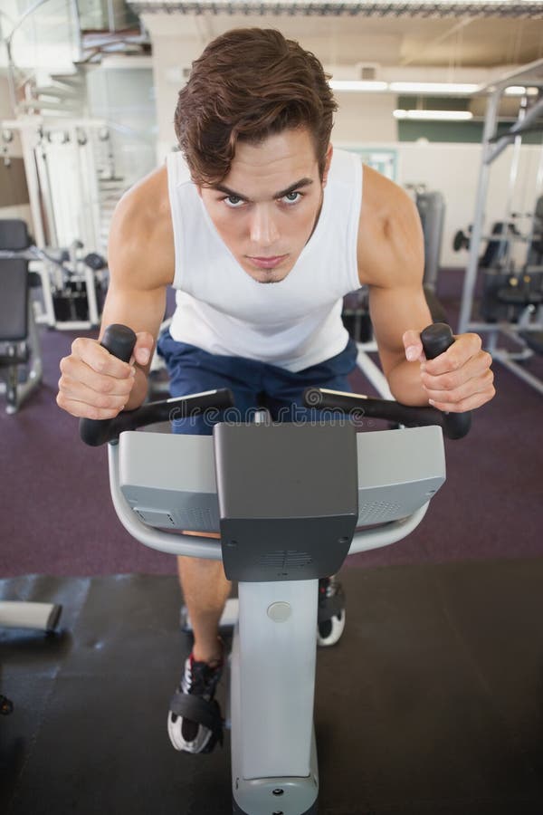 Fit Man Working Out on the Exercise Bike Stock Image - Image of ...