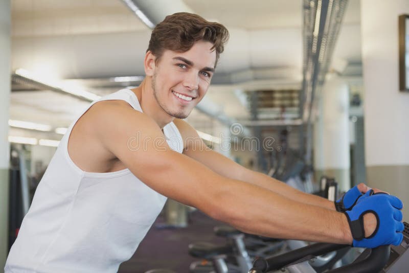 Fit Man Working Out on the Exercise Bike Stock Image - Image of studio ...