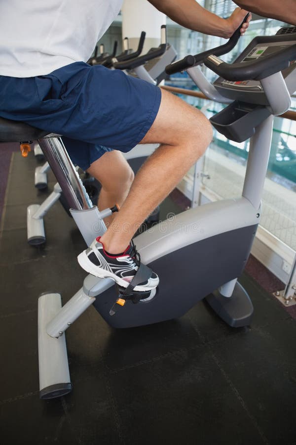 Fit Man Working Out on the Exercise Bike Stock Image - Image of angle ...