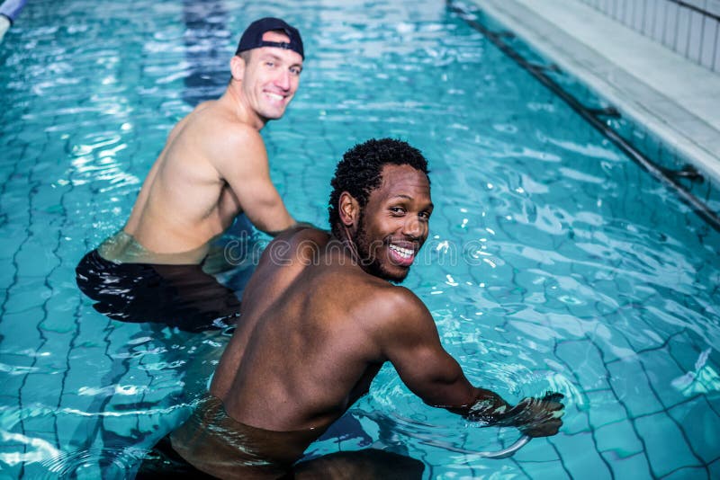 Fit Men Cycling in the Pool Stock Photo - Image of aqua, centre: 65358948