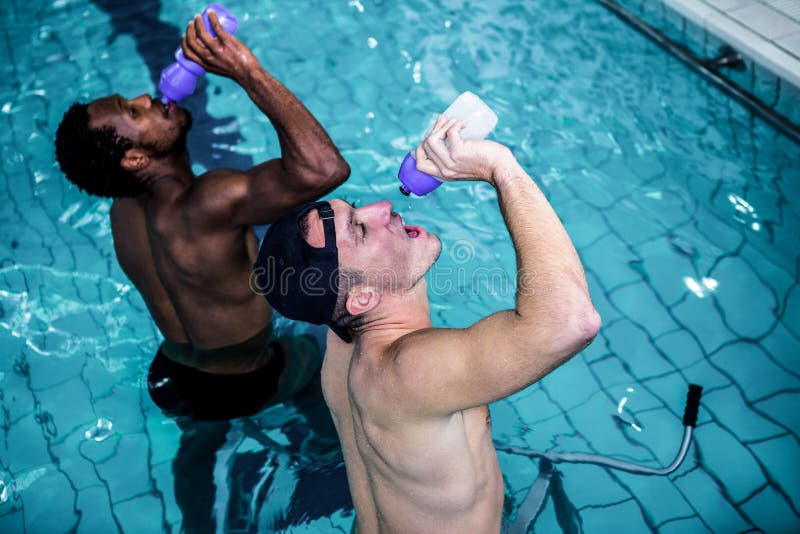 Fit Men Cycling in the Pool Stock Image - Image of hydration, leisure ...